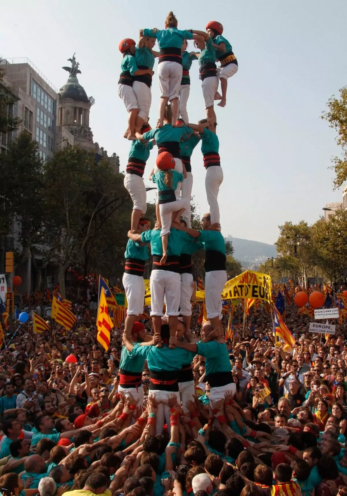 A group of Castellers form a human tower called a